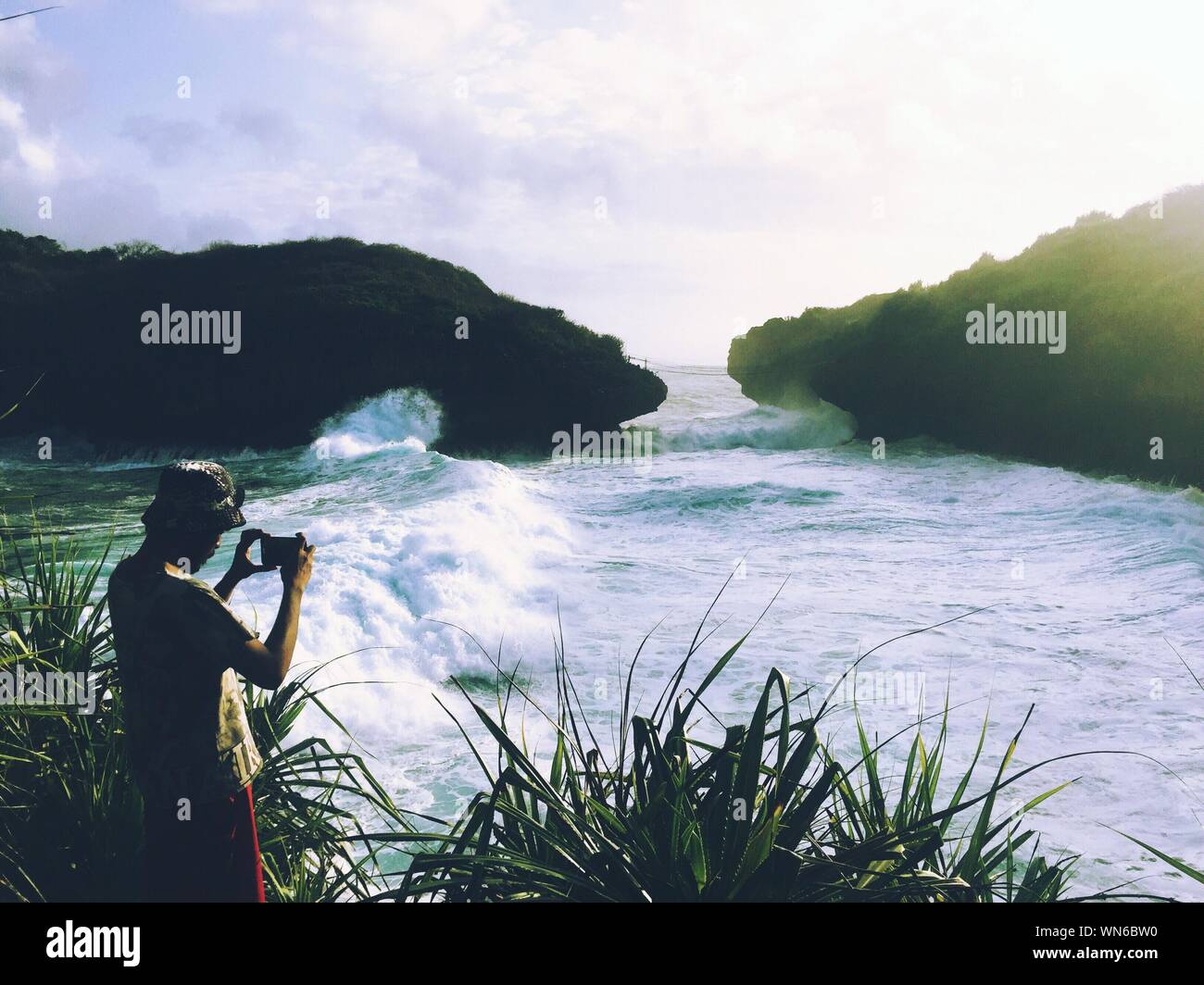 Man in waves hi-res stock photography and images - Alamy