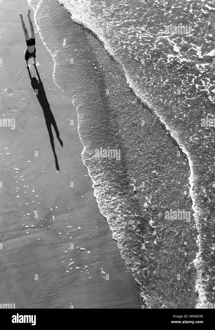 Doing handstand in sea hi-res stock photography and images - Alamy