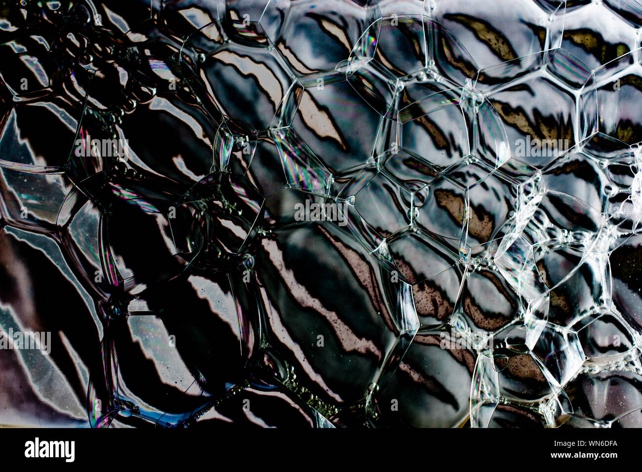 Oil bubbles inside water base form patterns Stock Photo - Alamy
