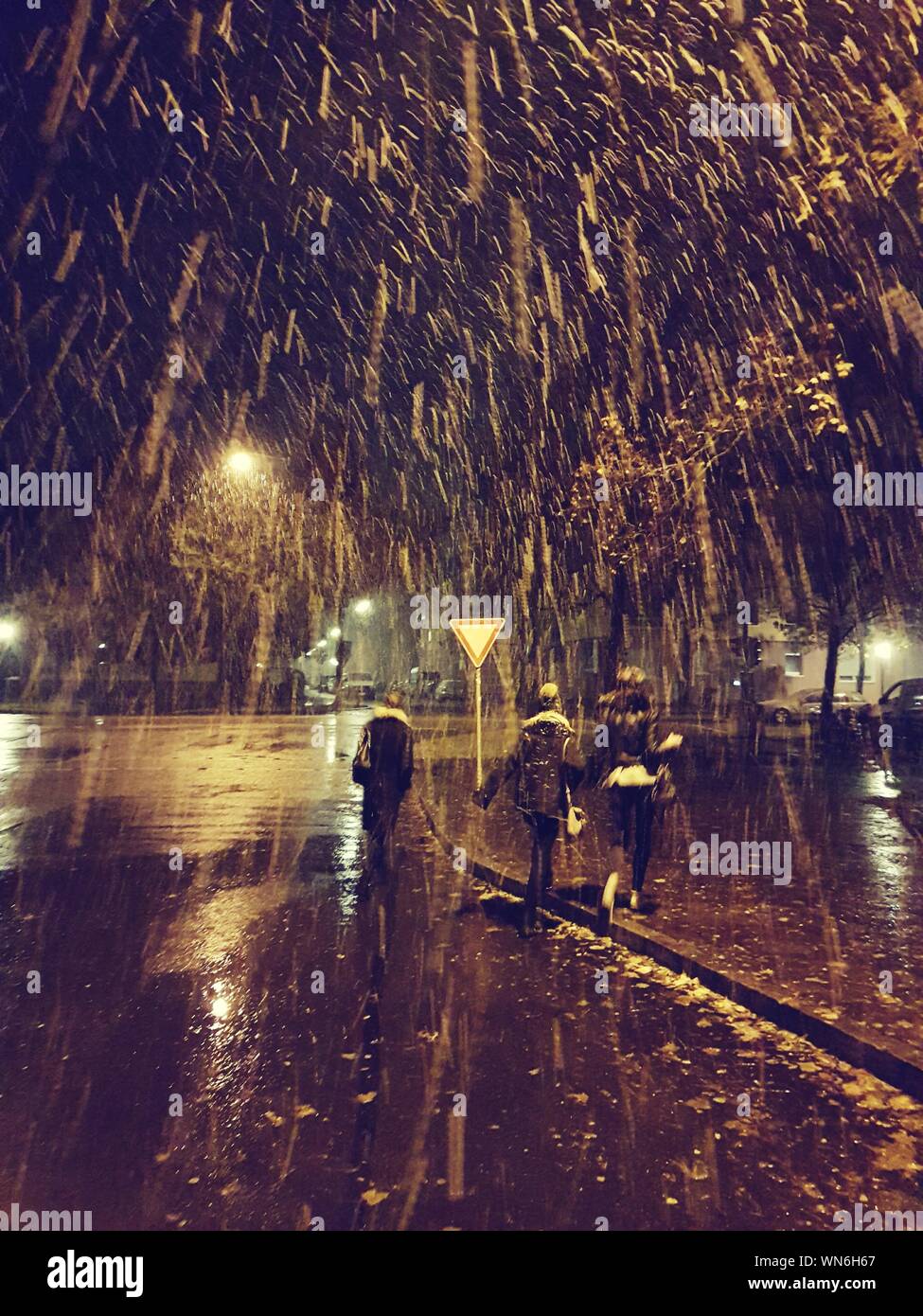People Walking In The Rain High Resolution Stock Photography and Images ...