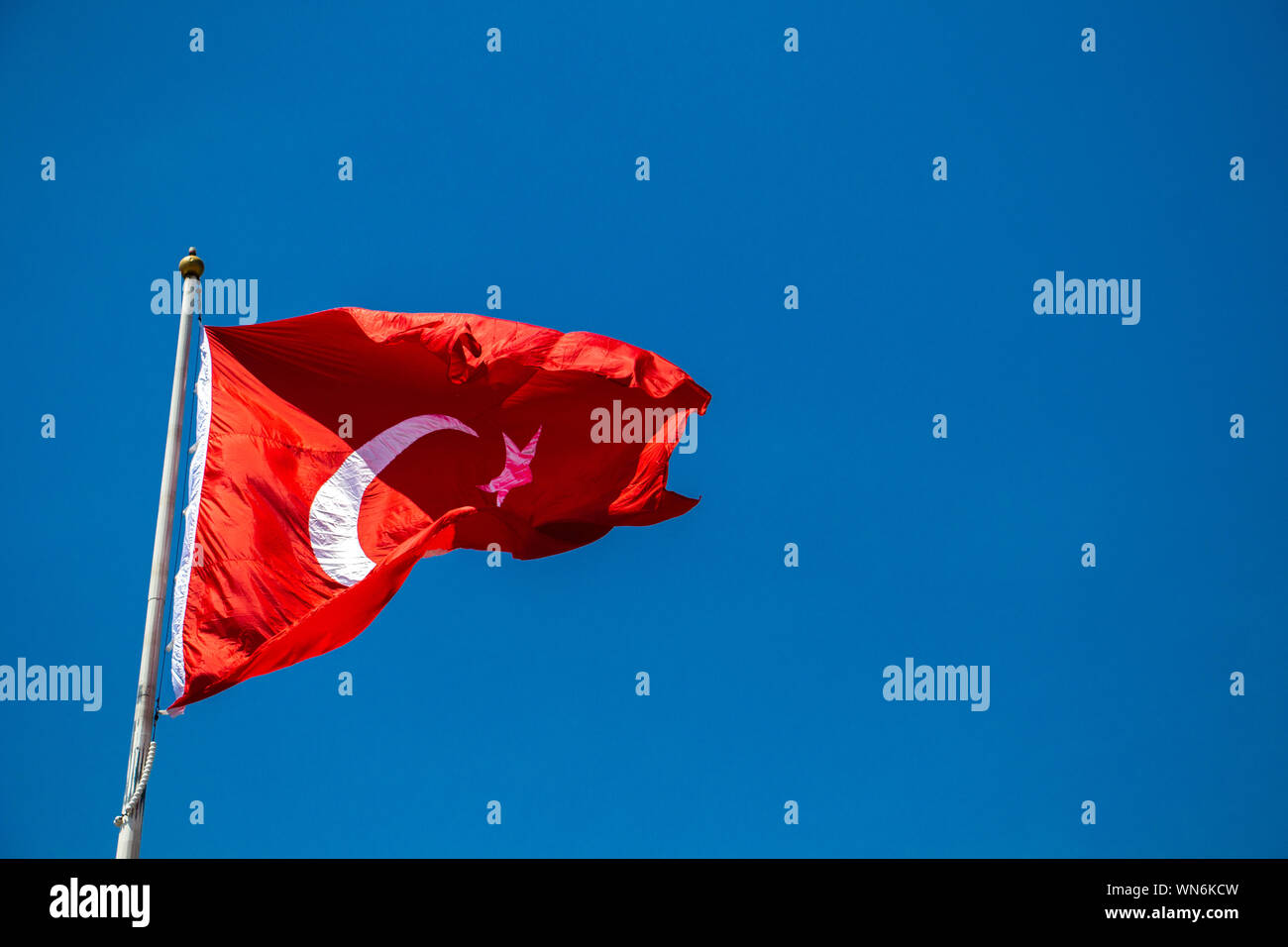 Turkish national flag with white star and moon in sky Stock Photo - Alamy
