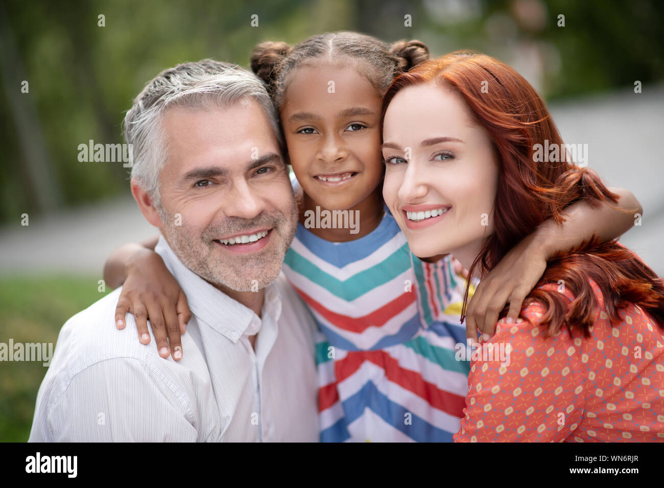 Happy family feeling amazing while spending time together Stock Photo ...