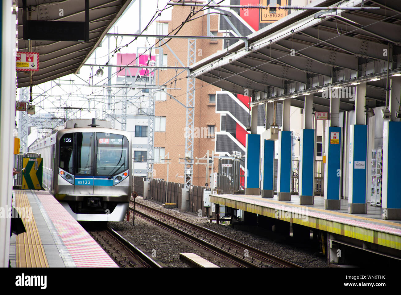 Japanese people and foreign traveler passengers wait and walking up and ...