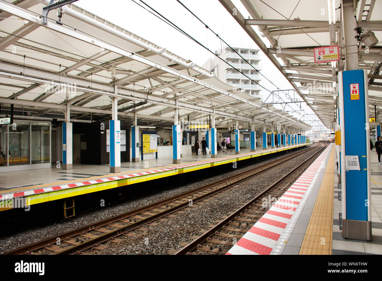 Japanese people and foreign traveler passengers wait and walking up and ...