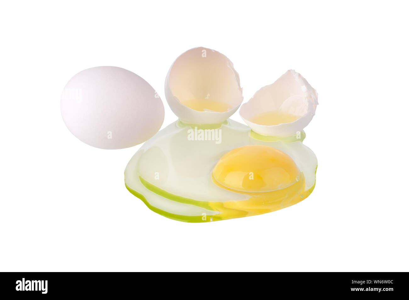 Broken white egg and one whole egg on white background isolated close ...