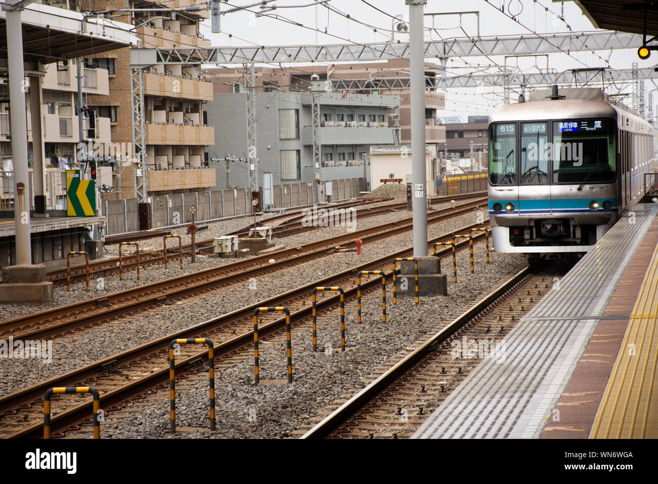 Japanese people and foreign traveler passengers wait and walking up and ...
