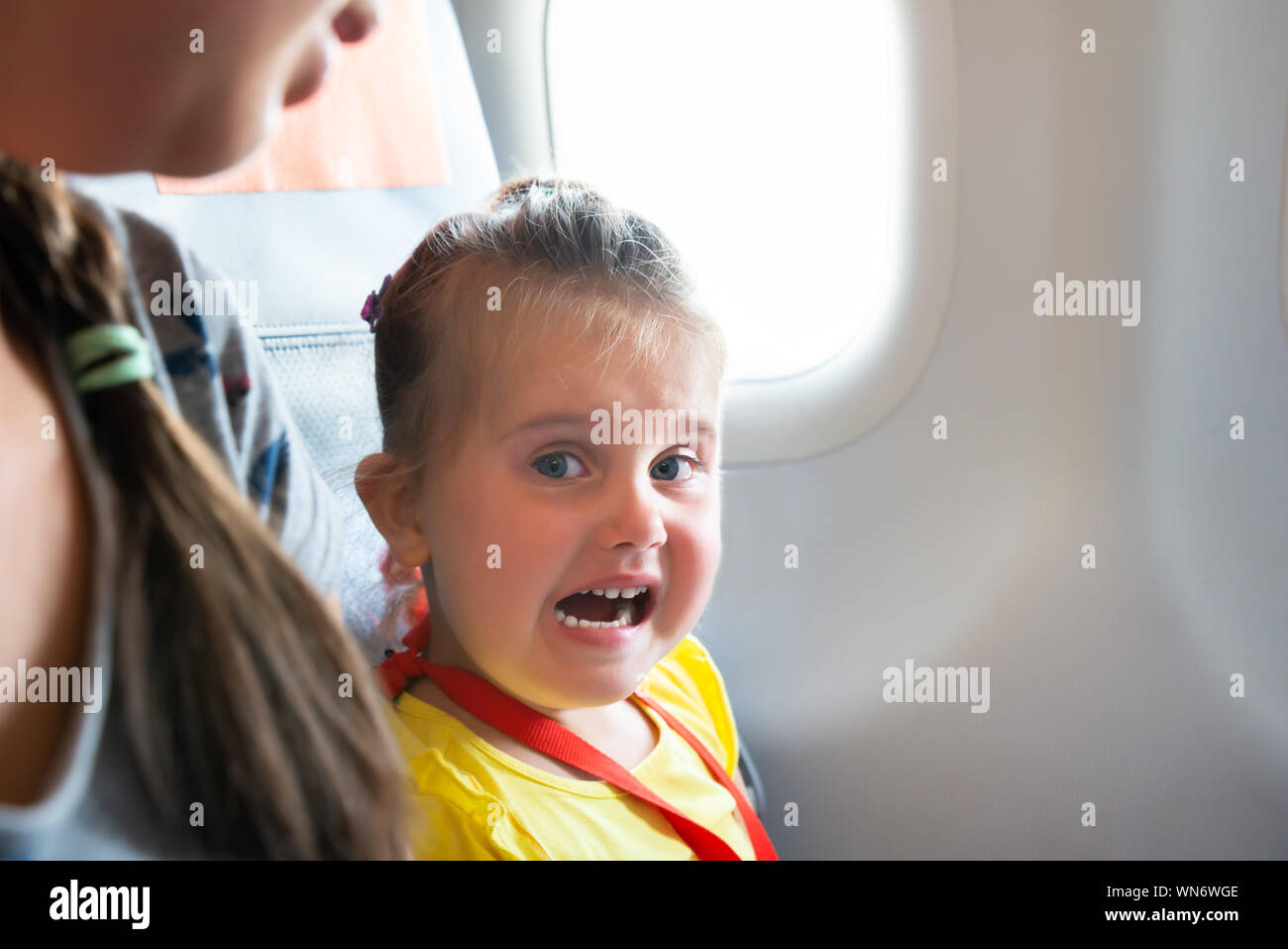 Baby cry airplane hi-res stock photography and images - Alamy