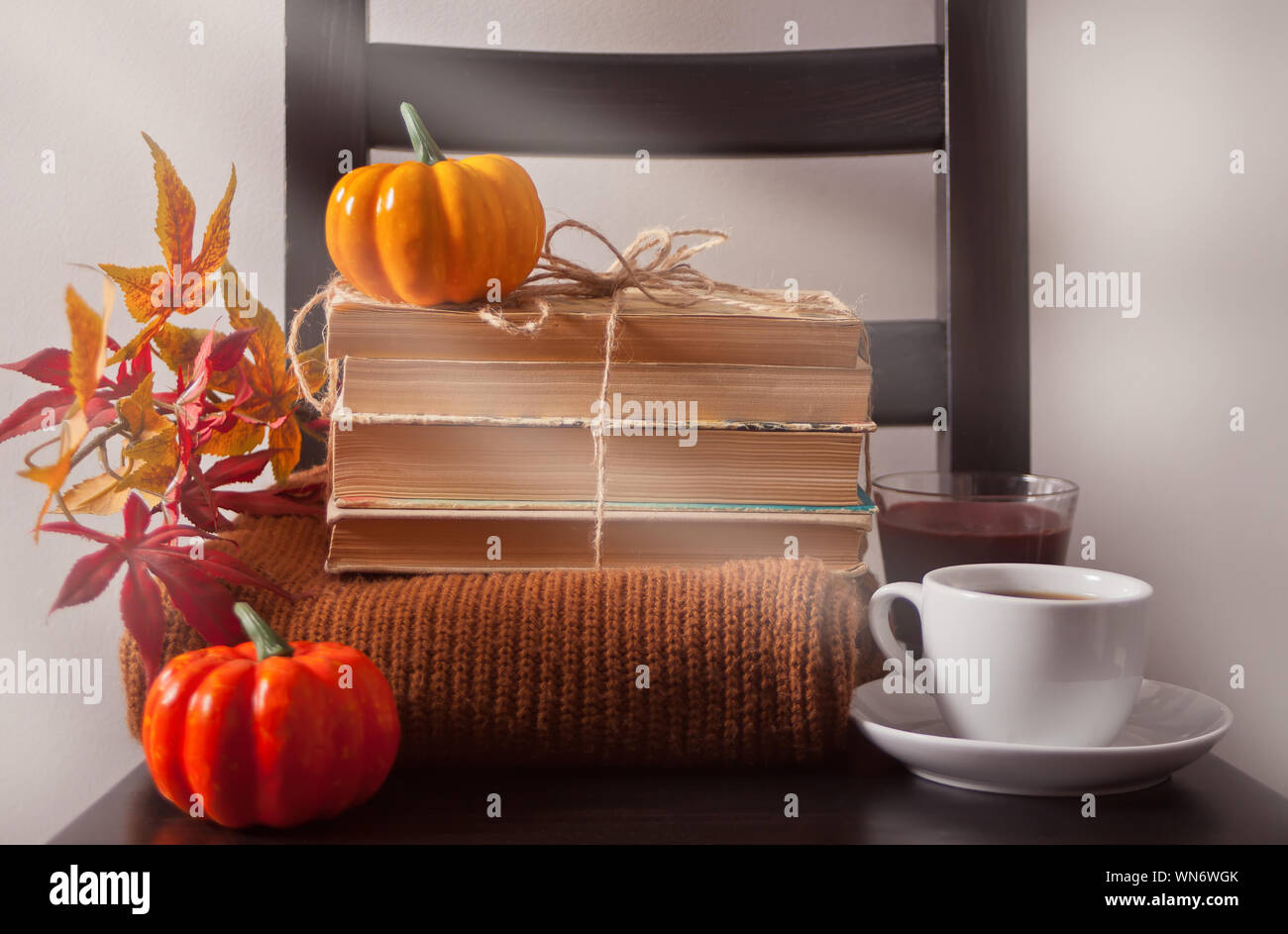 Cozy and warm composition with cup of coffee, autumn leaves, pumpkin ...