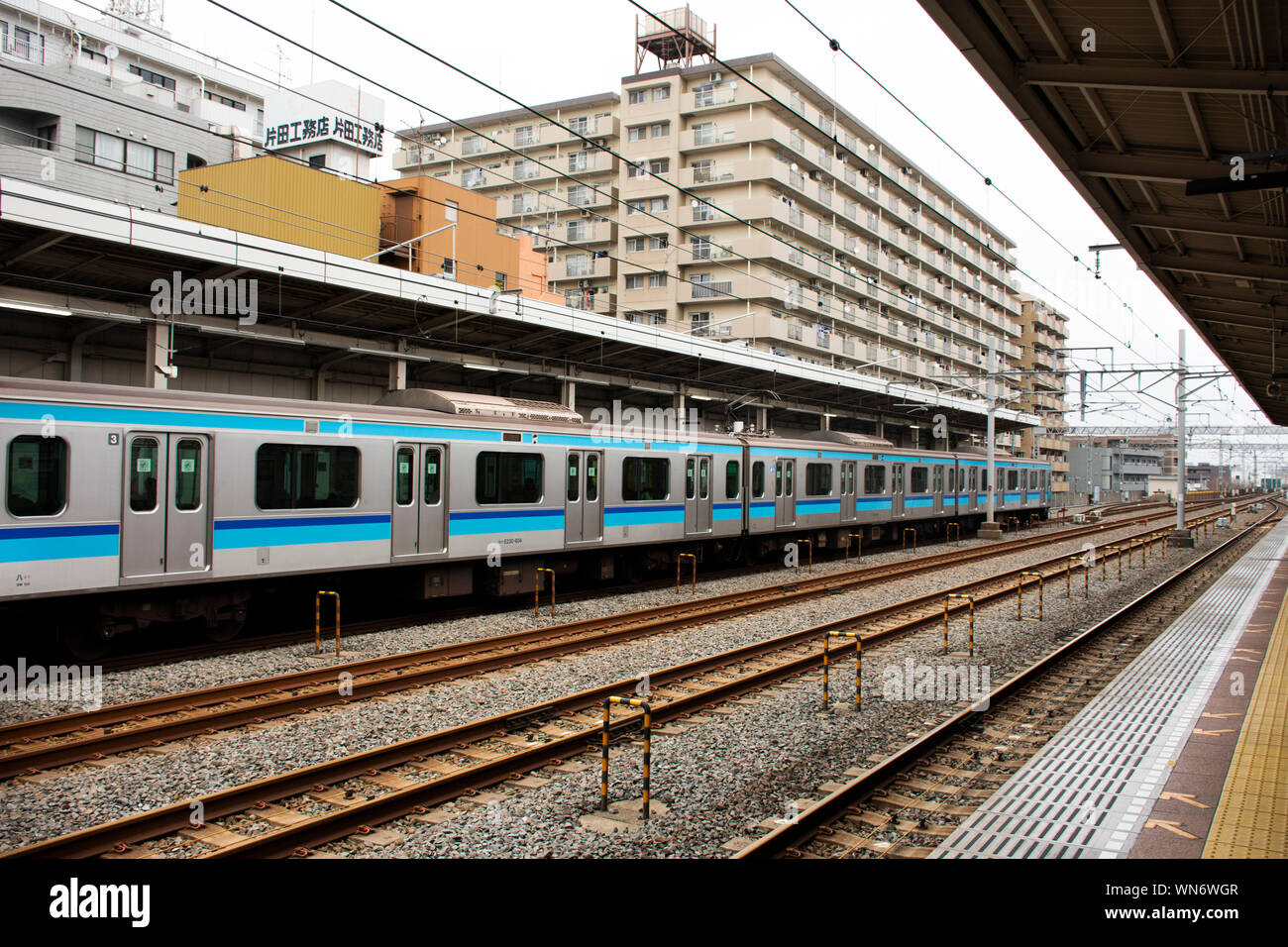 Japanese people and foreign traveler passengers wait and walking up and ...