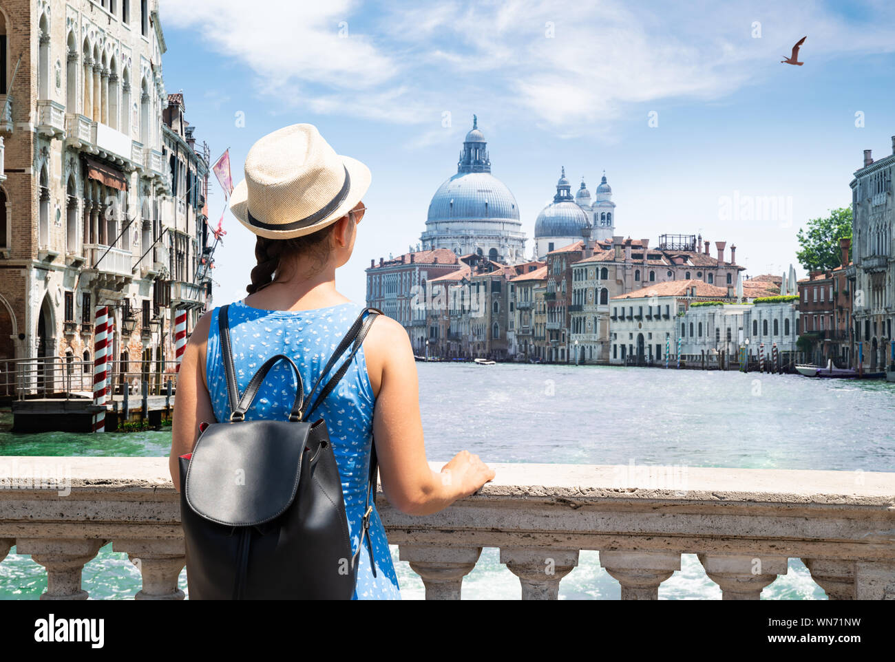 Rear View Of Female Tourist Looking At Grand Canal In Venice, Italy ...