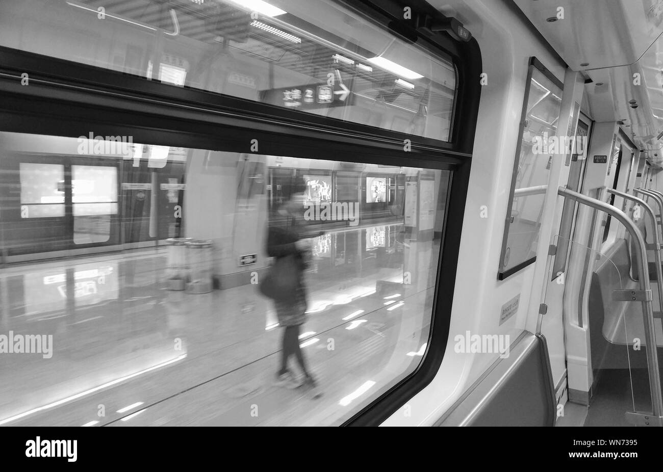 Train arriving at platform Black and White Stock Photos & Images - Alamy