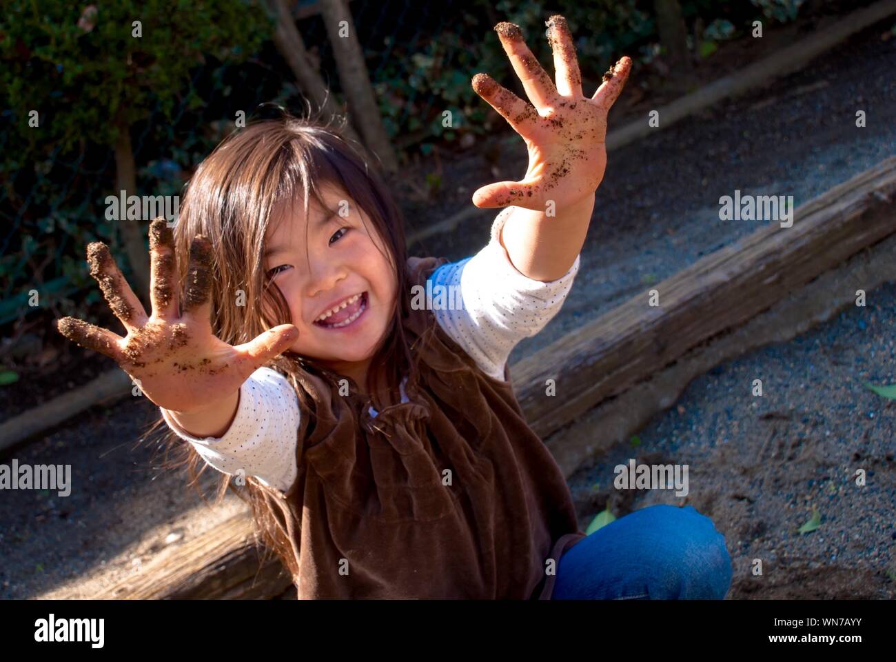 Girl showing her dirty hands hi-res stock photography and images - Alamy