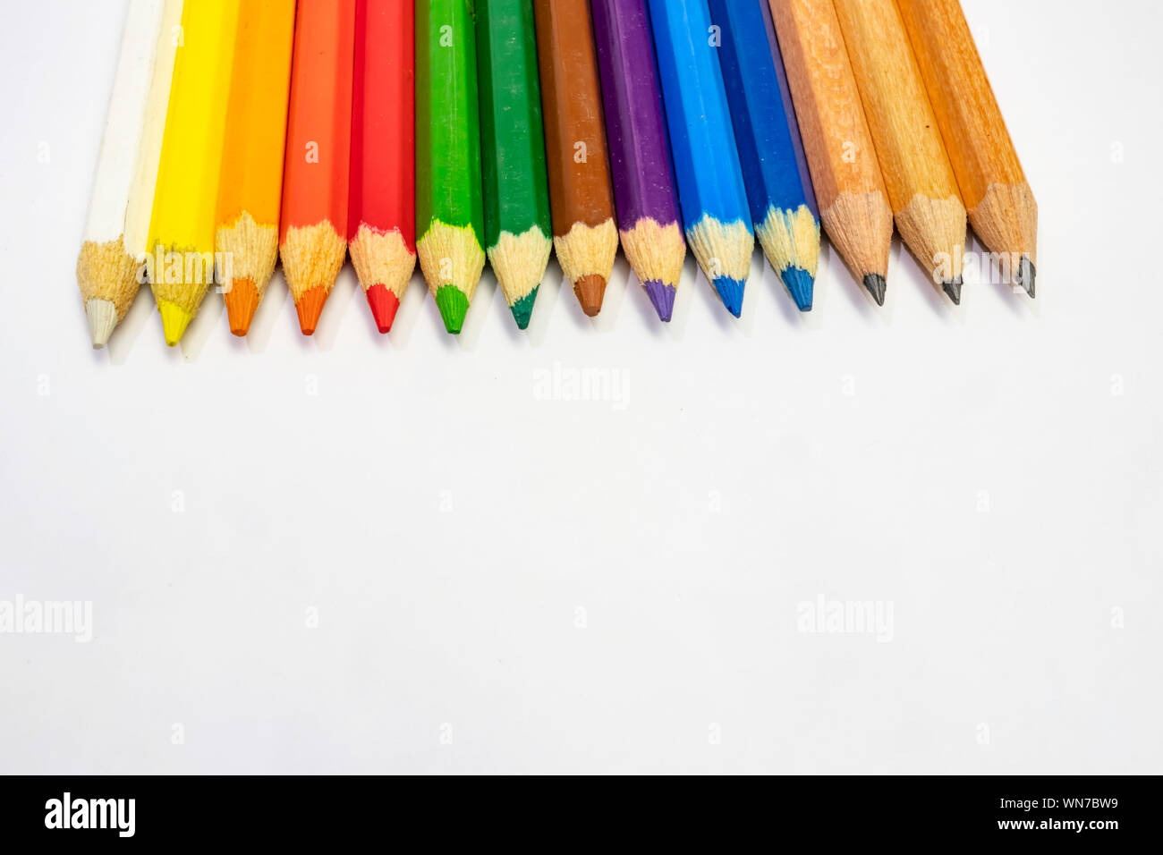 close up multi coloured pencils on white background Stock Photo - Alamy