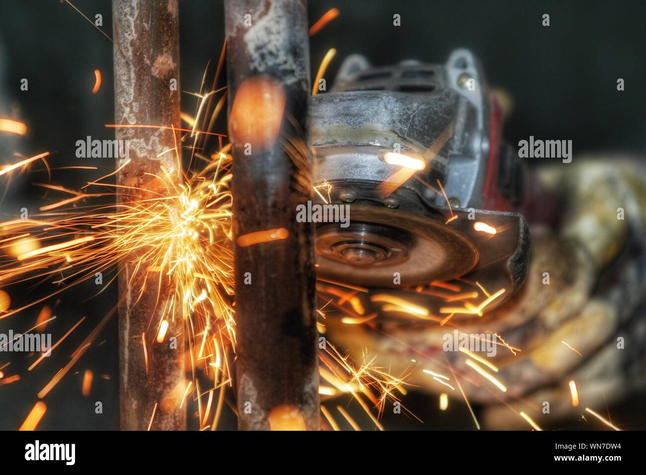 Worker using grinder hi-res stock photography and images - Alamy