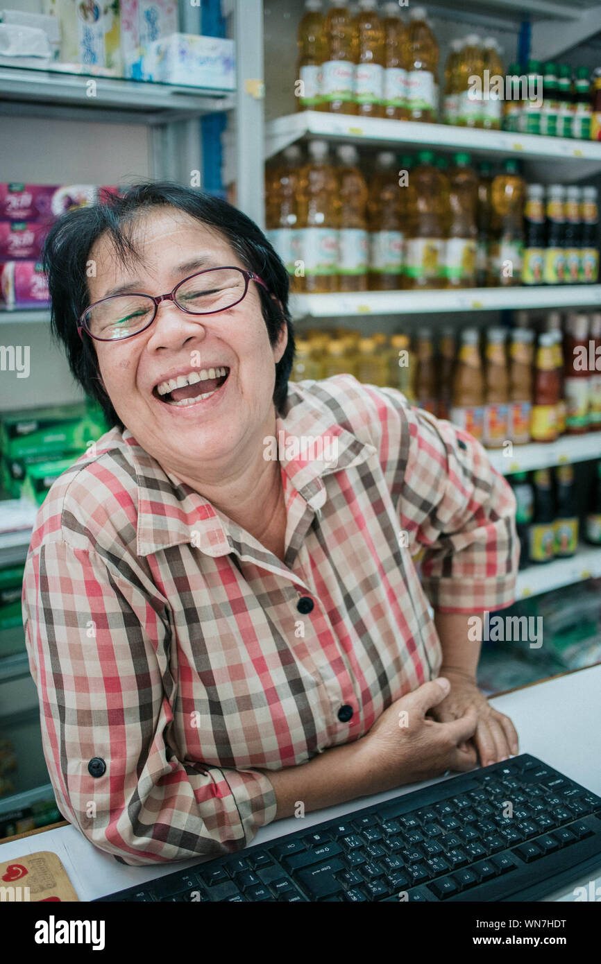 Woman at counter hi-res stock photography and images - Alamy