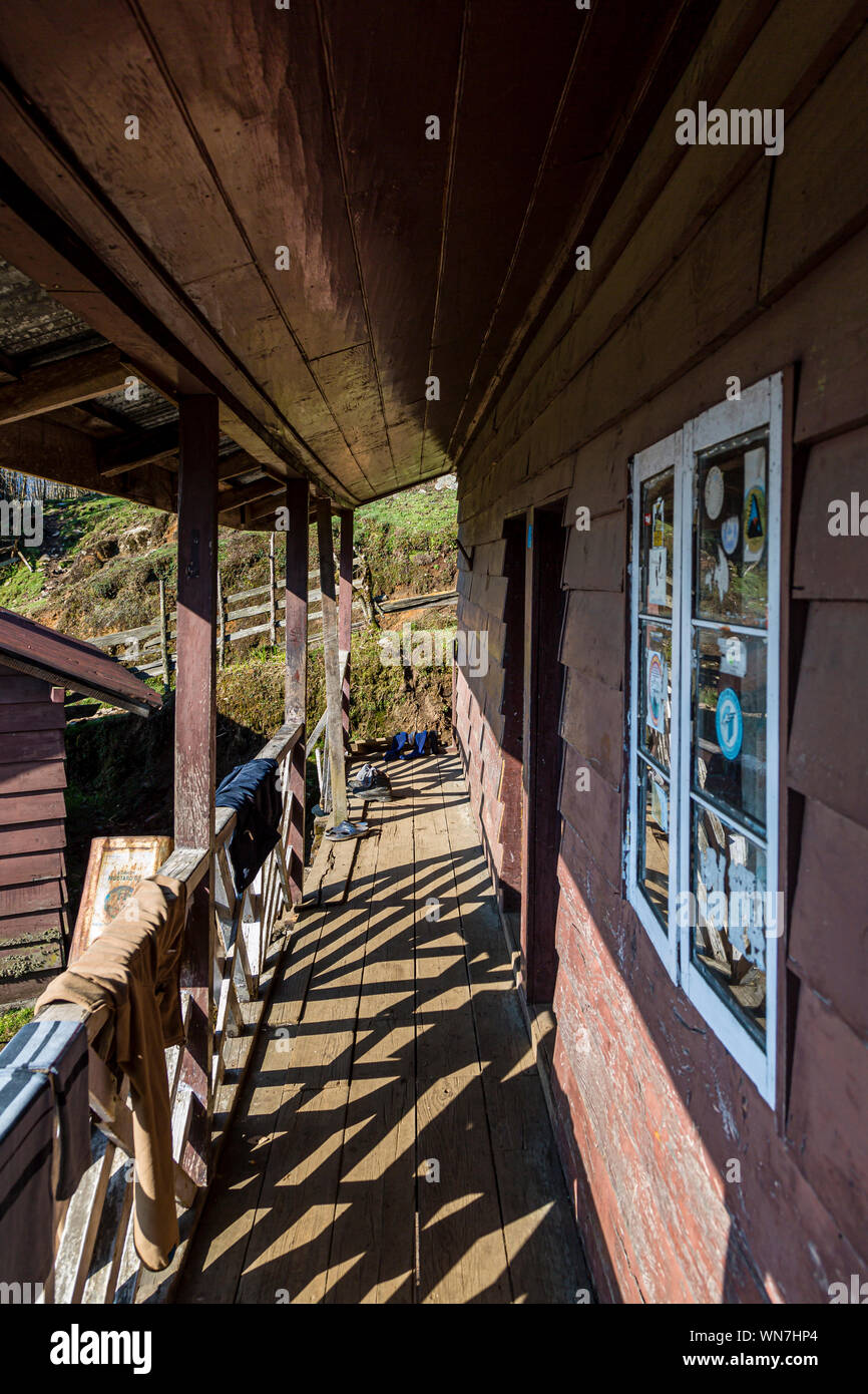 Balcony of a wooden rest house at Tshoka on the Gochela trek in the ...
