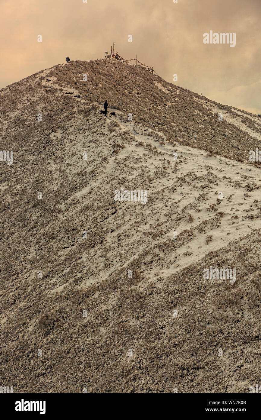 A trekker climbs a snowy mountain on the Gochela trek in the ...