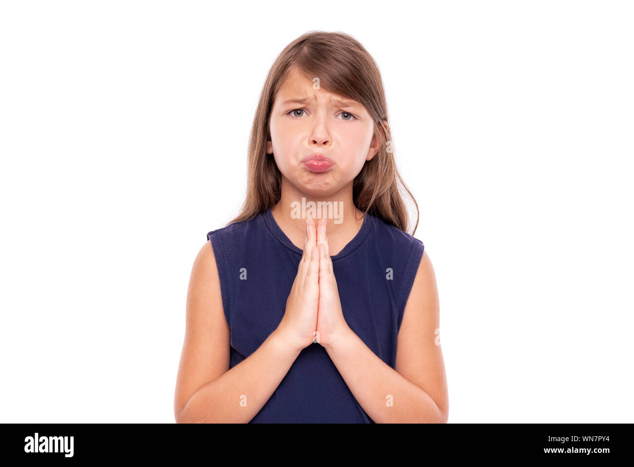 Little girl folded her hands in prayer Stock Photo - Alamy