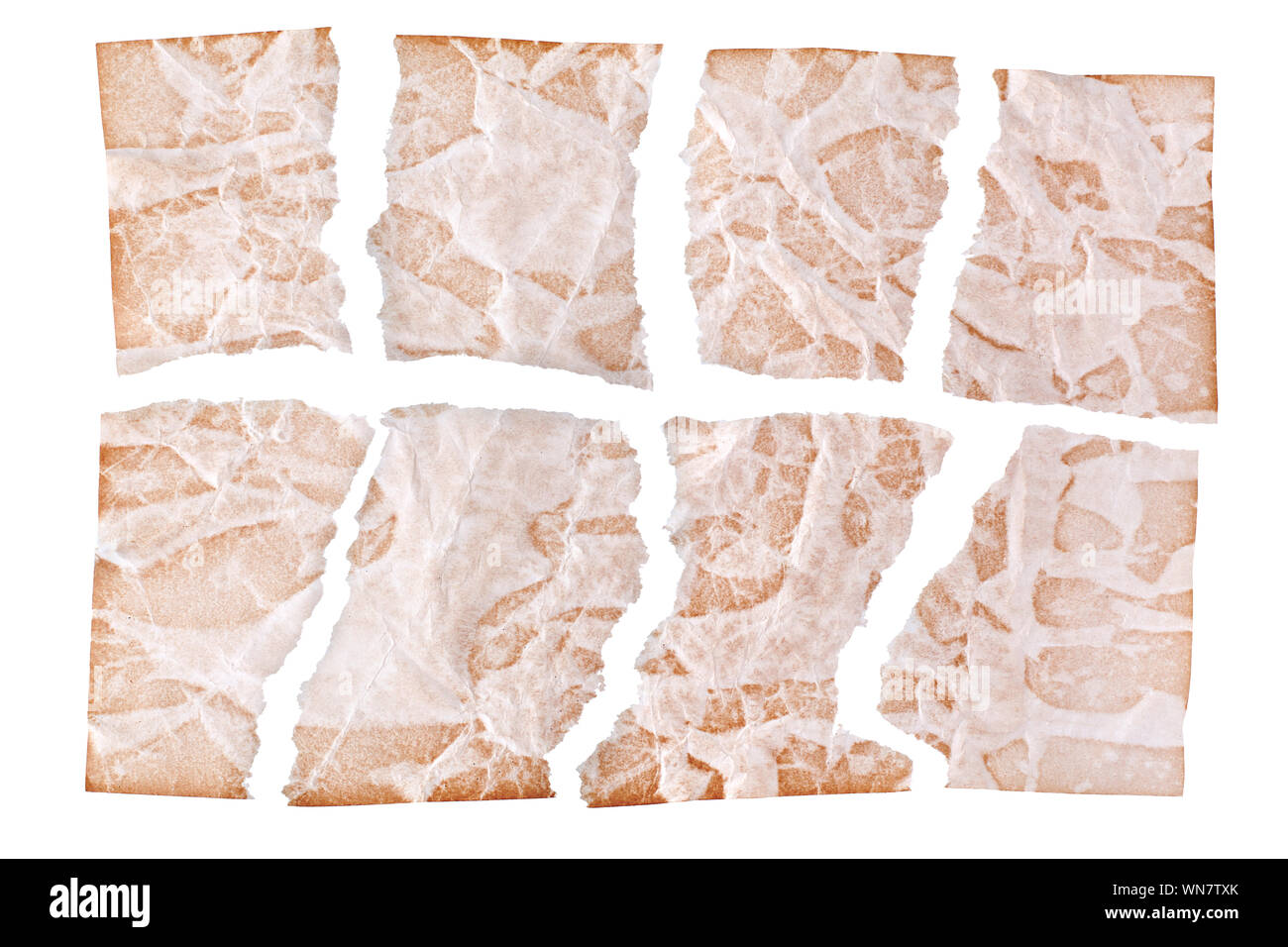 Torn sheets of brown aged paper on white background isolated close up ...