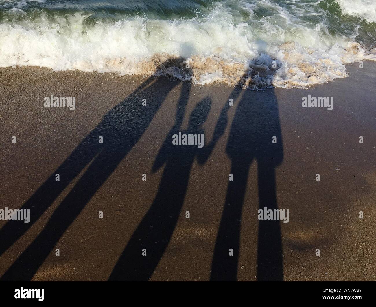 Parents child hands shadow hi-res stock photography and images - Alamy