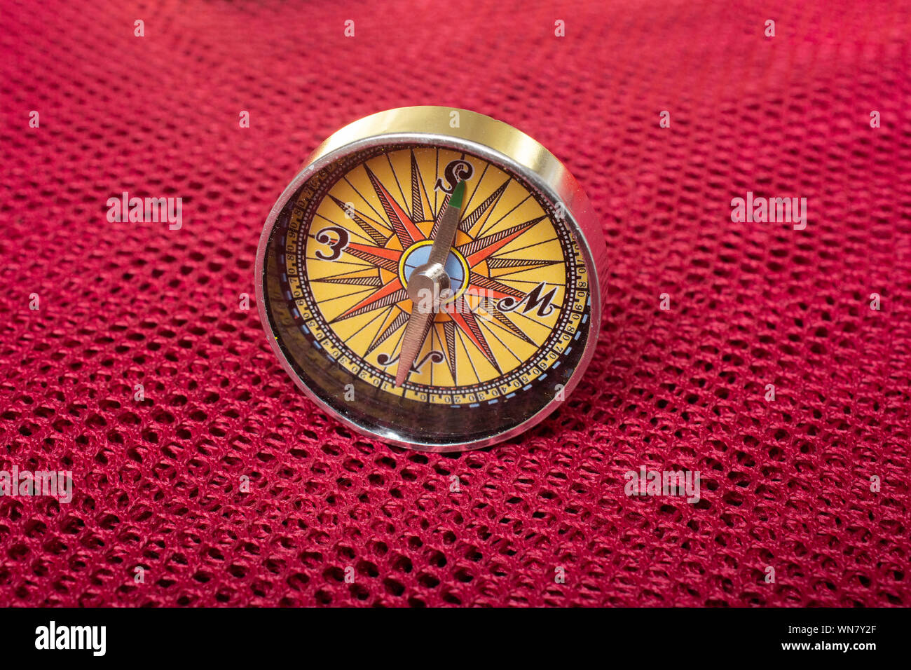 Magnetic compass tool as a concept of traveling Stock Photo - Alamy