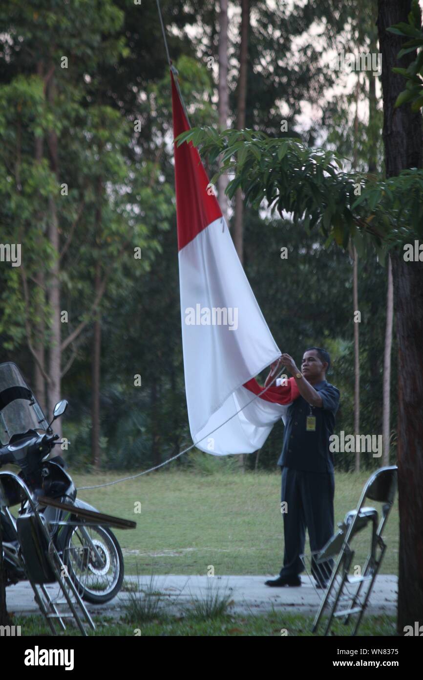 Tying national flag hi-res stock photography and images - Alamy