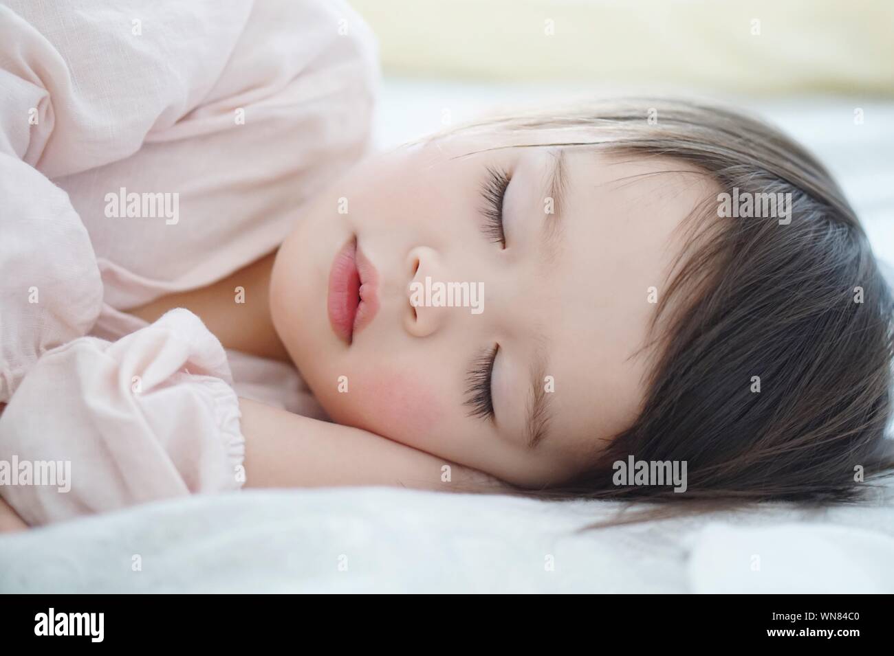 Sleeping girl in bed hi-res stock photography and images - Alamy