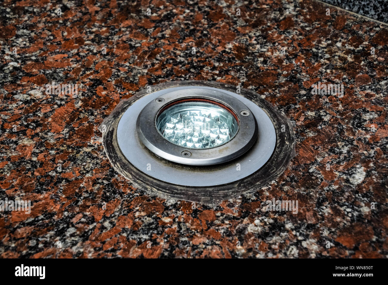 LED backlight in granite stone. Light fixture Stock Photo - Alamy