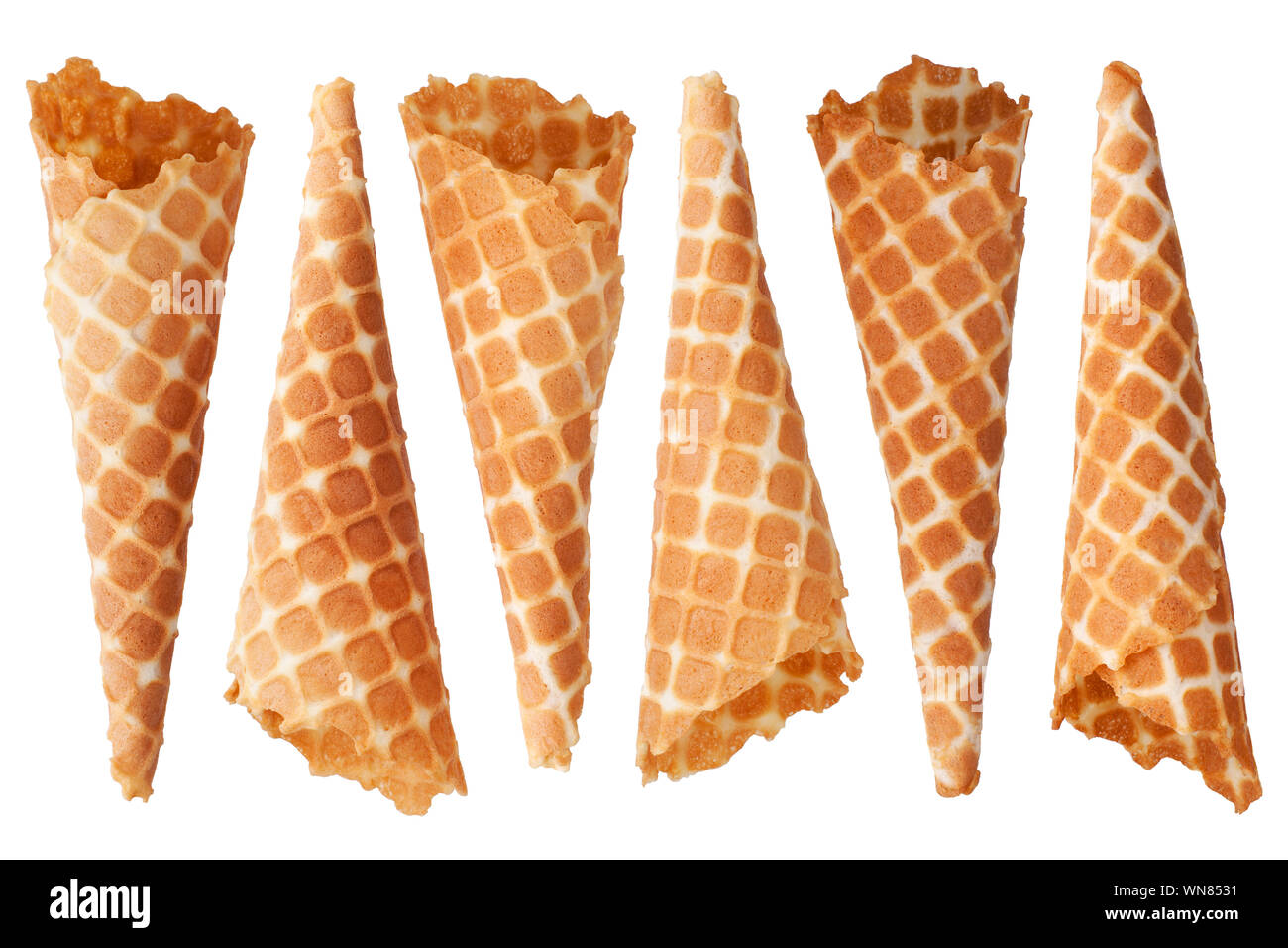 Six golden crispy ice-cream waffle cones on white background isolated ...