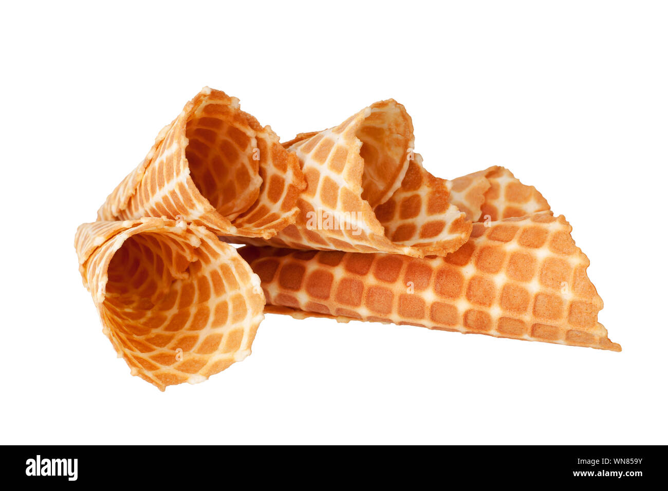 Crispy ice cream golden waffle cones on white background isolated close ...