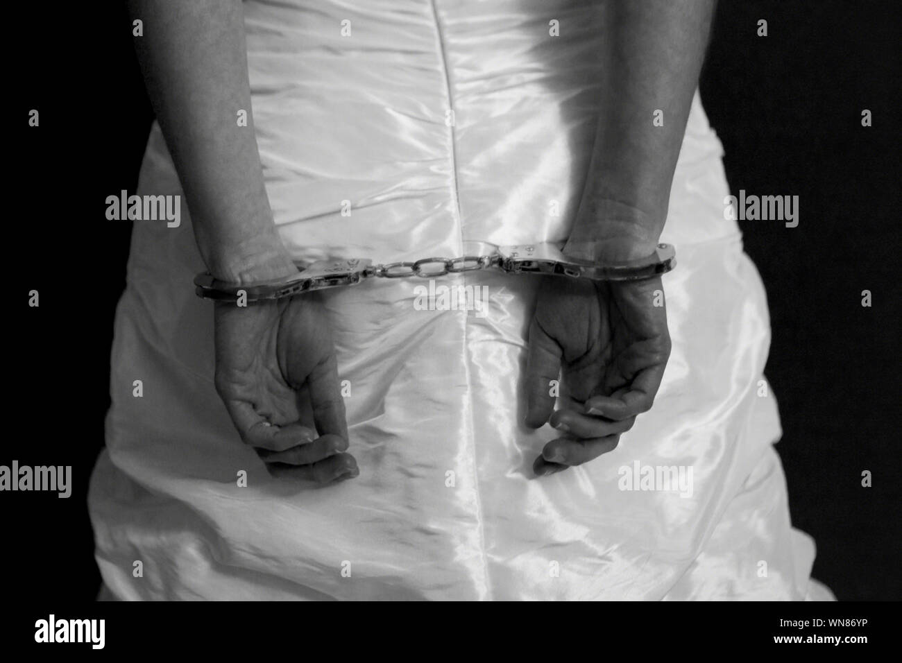 Woman with handcuffs hi-res stock photography and images - Alamy