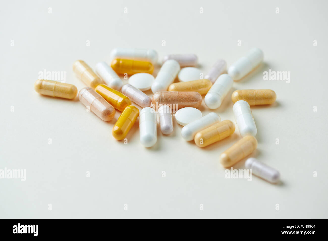 Vitamins and supplements on bright paper background. Concept for a ...