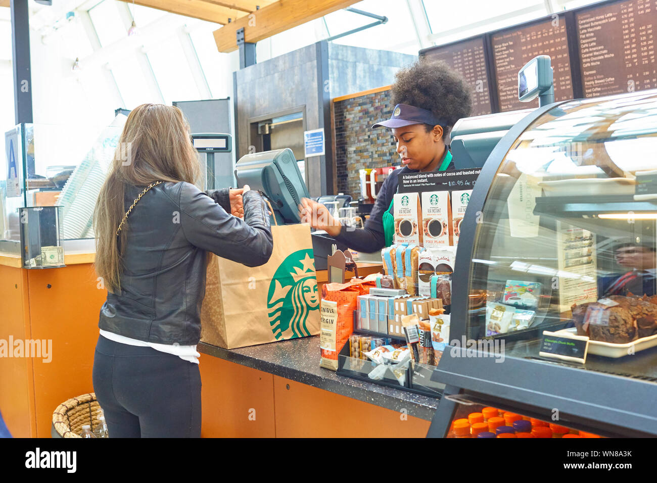 NEW YORK CITY, NY - CIRCA MARCH, 2016: woman pick up order at Starbucks ...