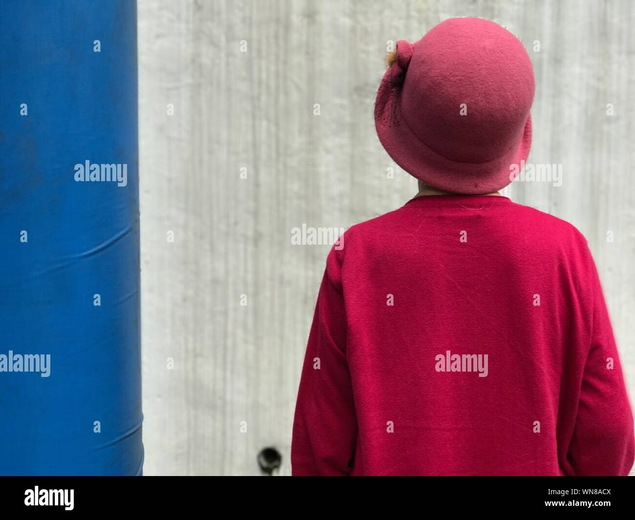 Woman rear view red coat hi-res stock photography and images - Alamy