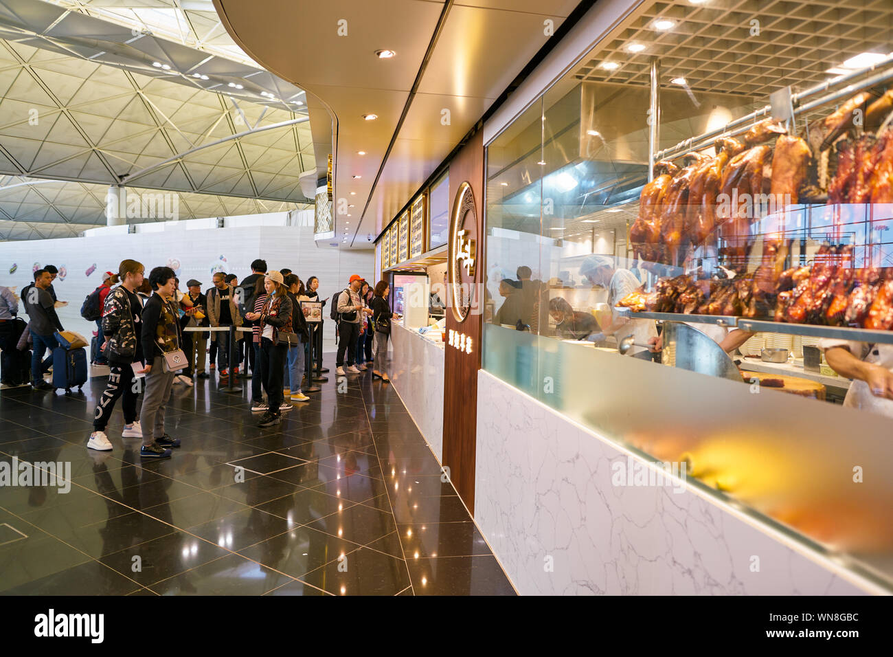 HONG KONG, CHINA - CIRCA FEBRUARY, 2019: people standing in queue at ...