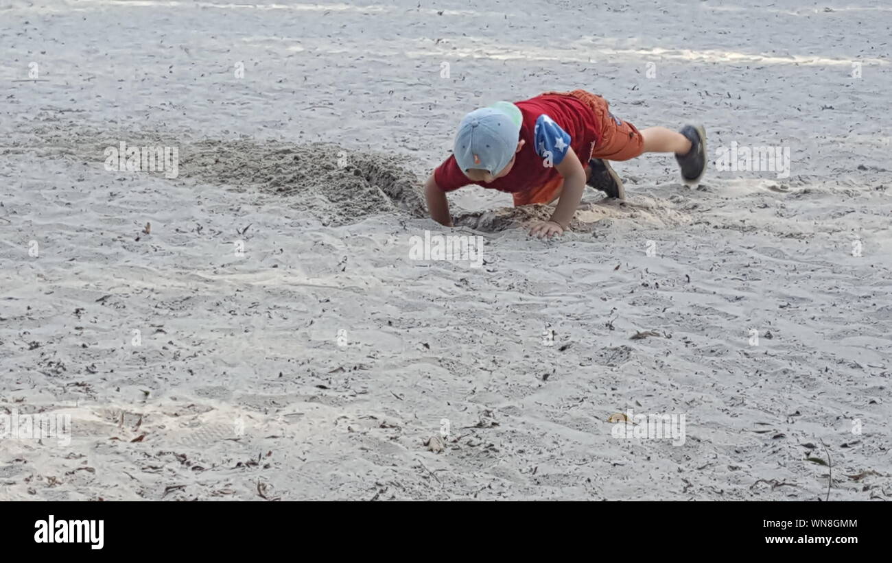 Boy Digging Sand High Resolution Stock Photography and Images - Alamy