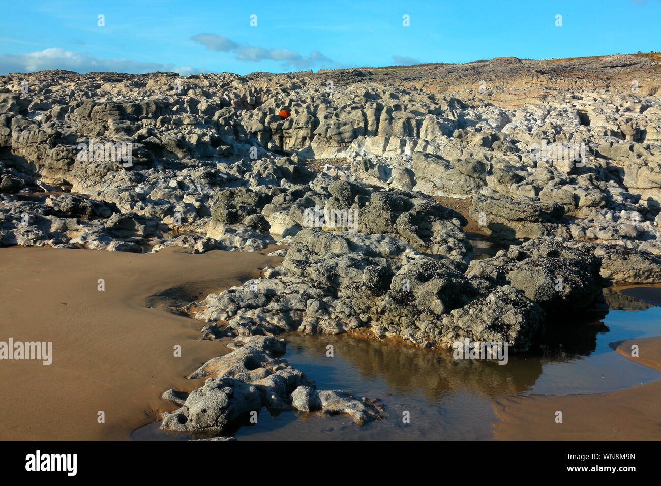 A washed ashore hollow steel buoy or fishing net float made from steel ...
