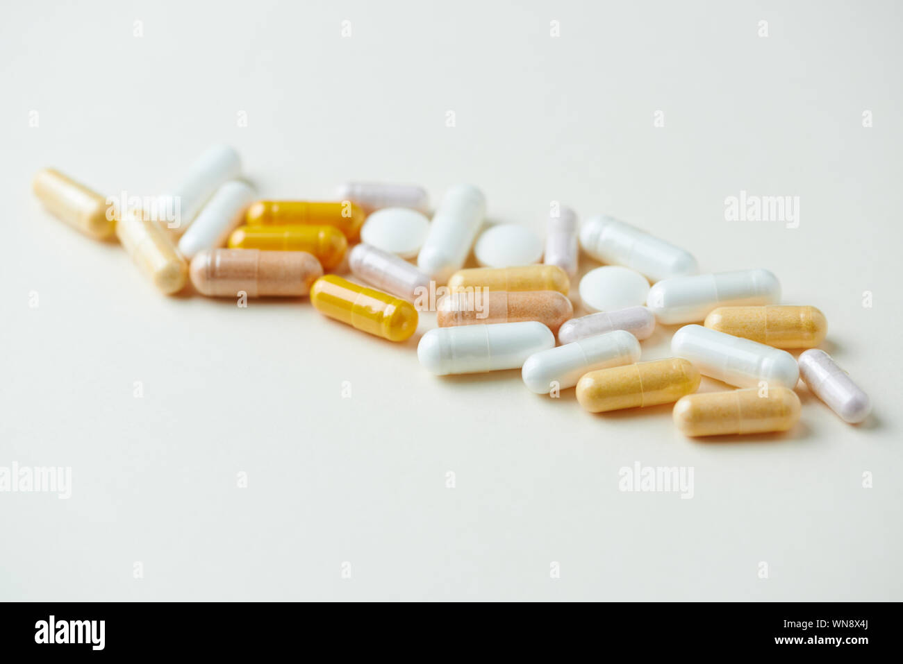 Vitamins and supplements on bright paper background. Concept for a ...
