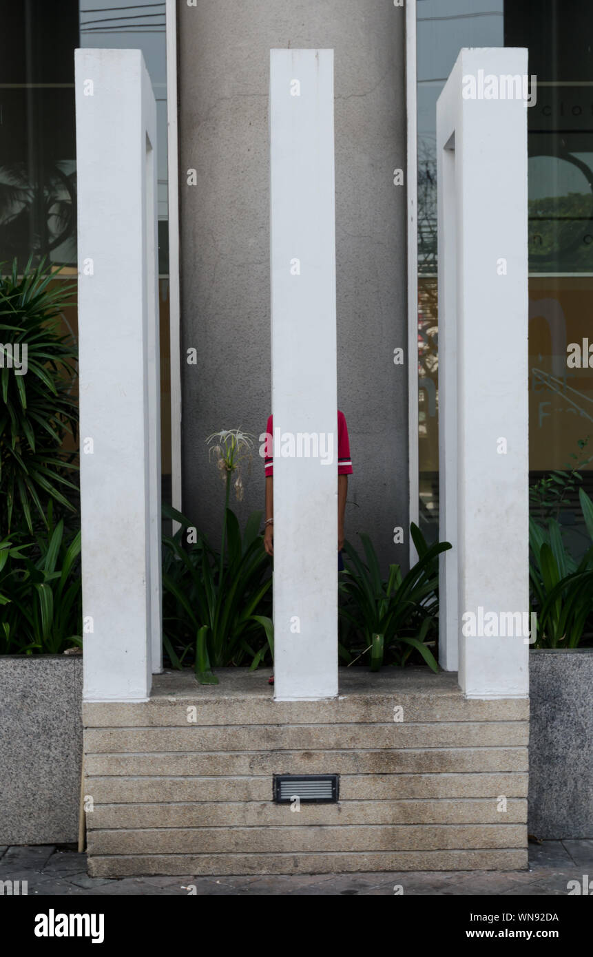 Hiding behind column hi-res stock photography and images - Alamy