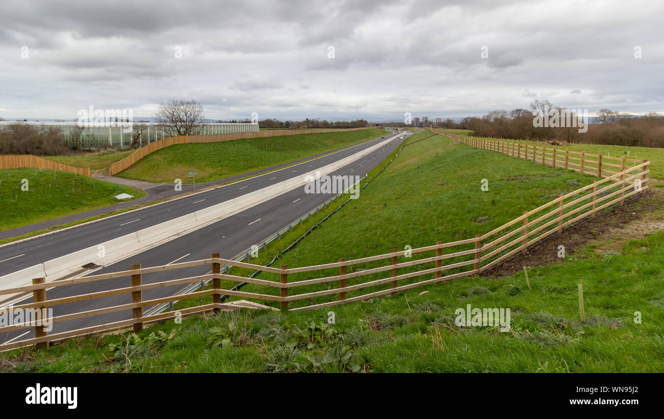New road passing through city Stock Photo - Alamy