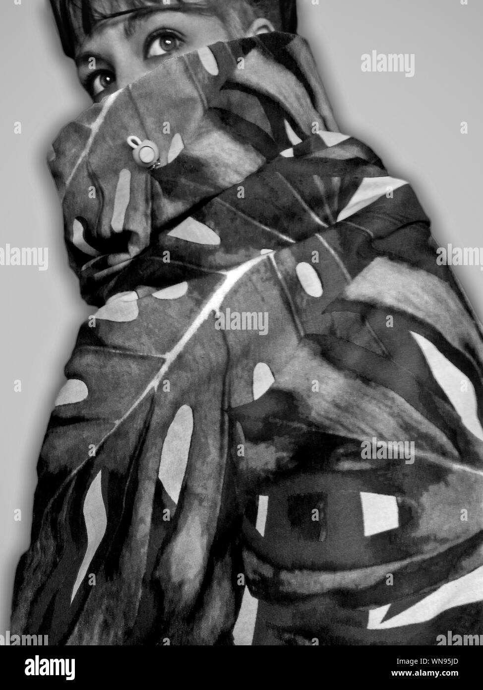 Woman Wrapped In Patterned Fabric Against White Background Stock Photo ...