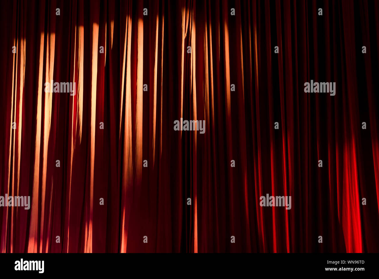 Red curtains and the spotlight in the Theater between shows Stock Photo ...