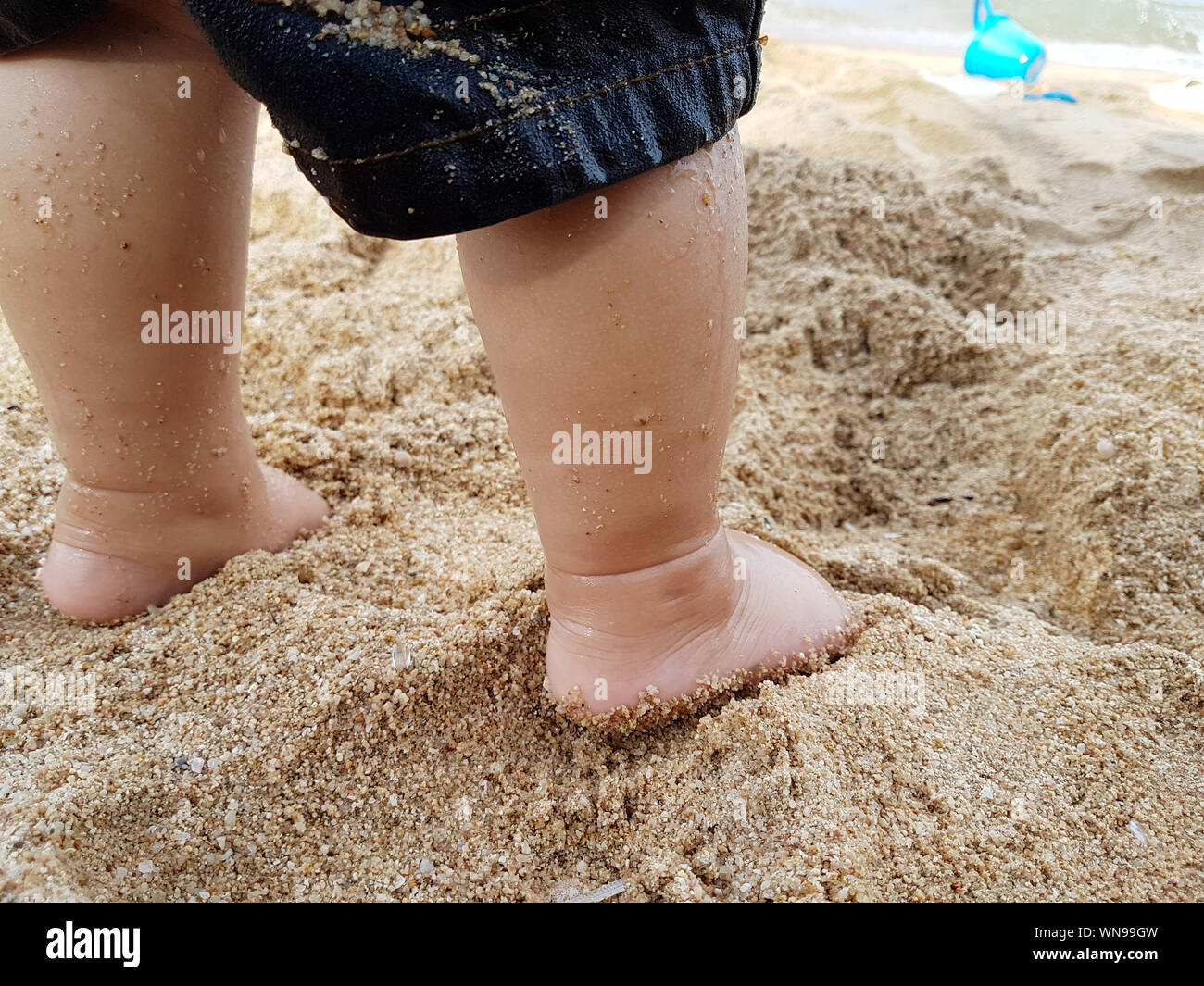 Baby in the sand hi-res stock photography and images - Alamy