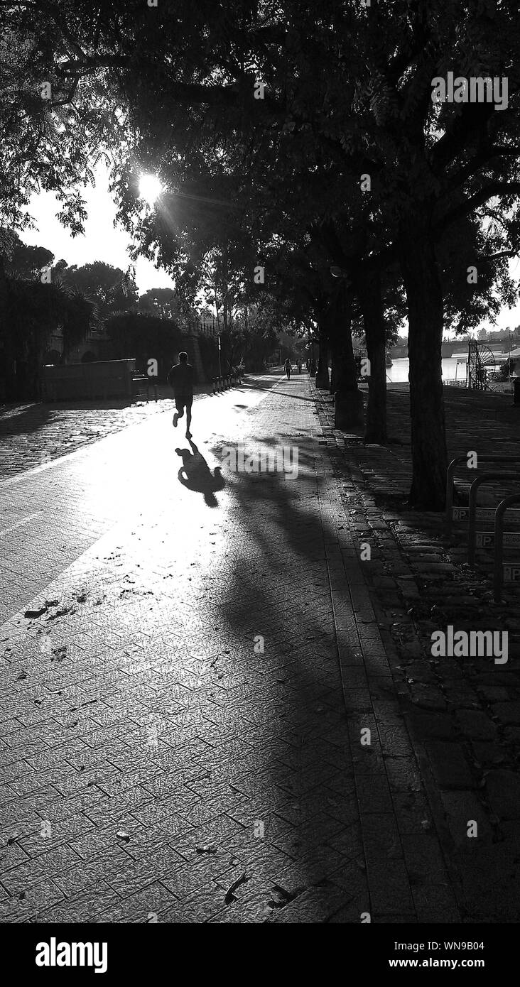 Man running park rear view Black and White Stock Photos & Images - Alamy