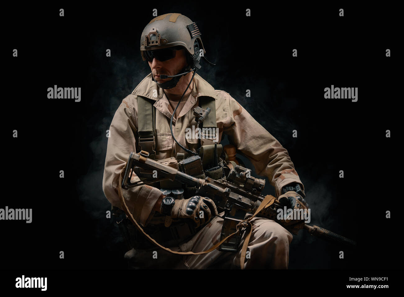 Safety helmet holding rifle army soldier military hi-res stock ...