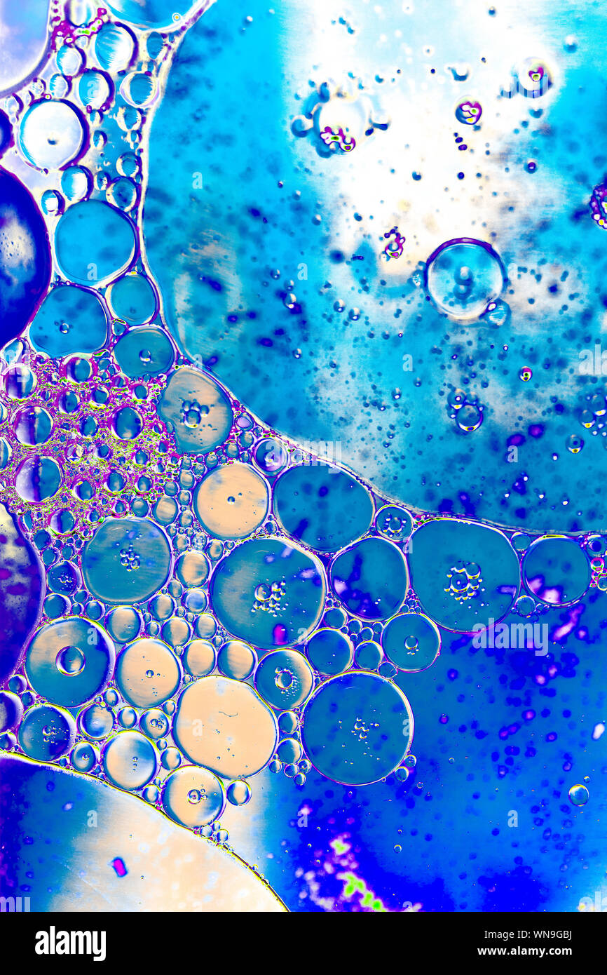 Oil bubbles inside water base form patterns Stock Photo - Alamy