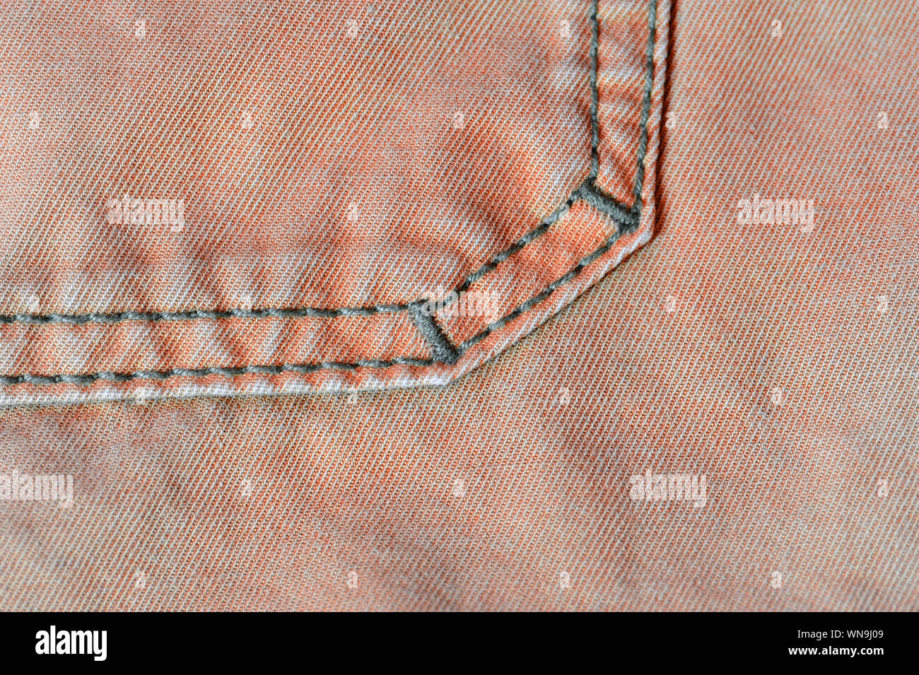 Orange color old denim texture close up. Textile background Stock Photo ...