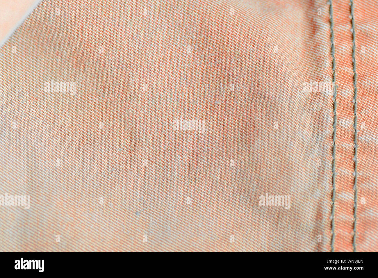 Orange color old denim texture close up. Textile background Stock Photo ...