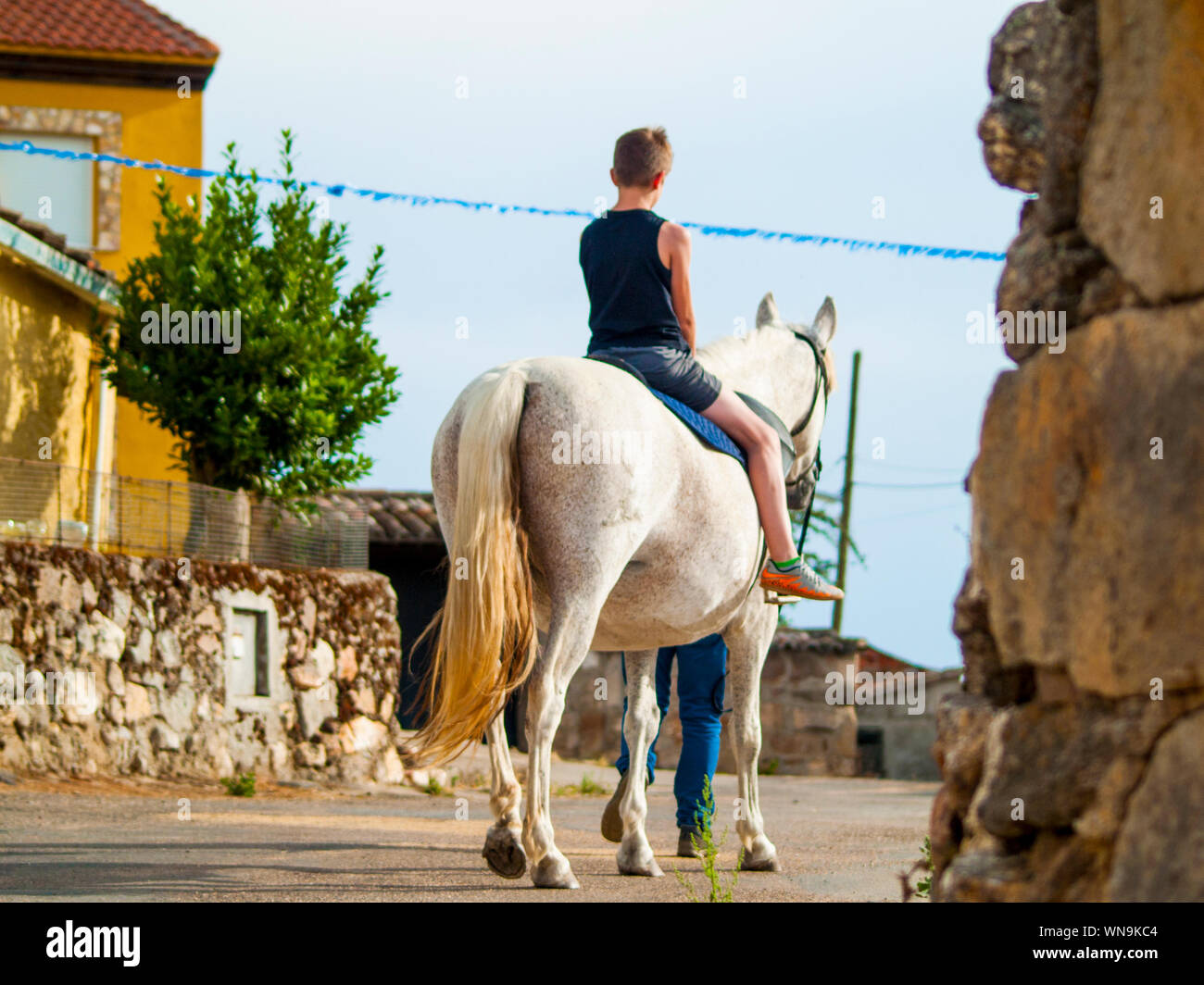 Boy riding on horse hi-res stock photography and images - Alamy
