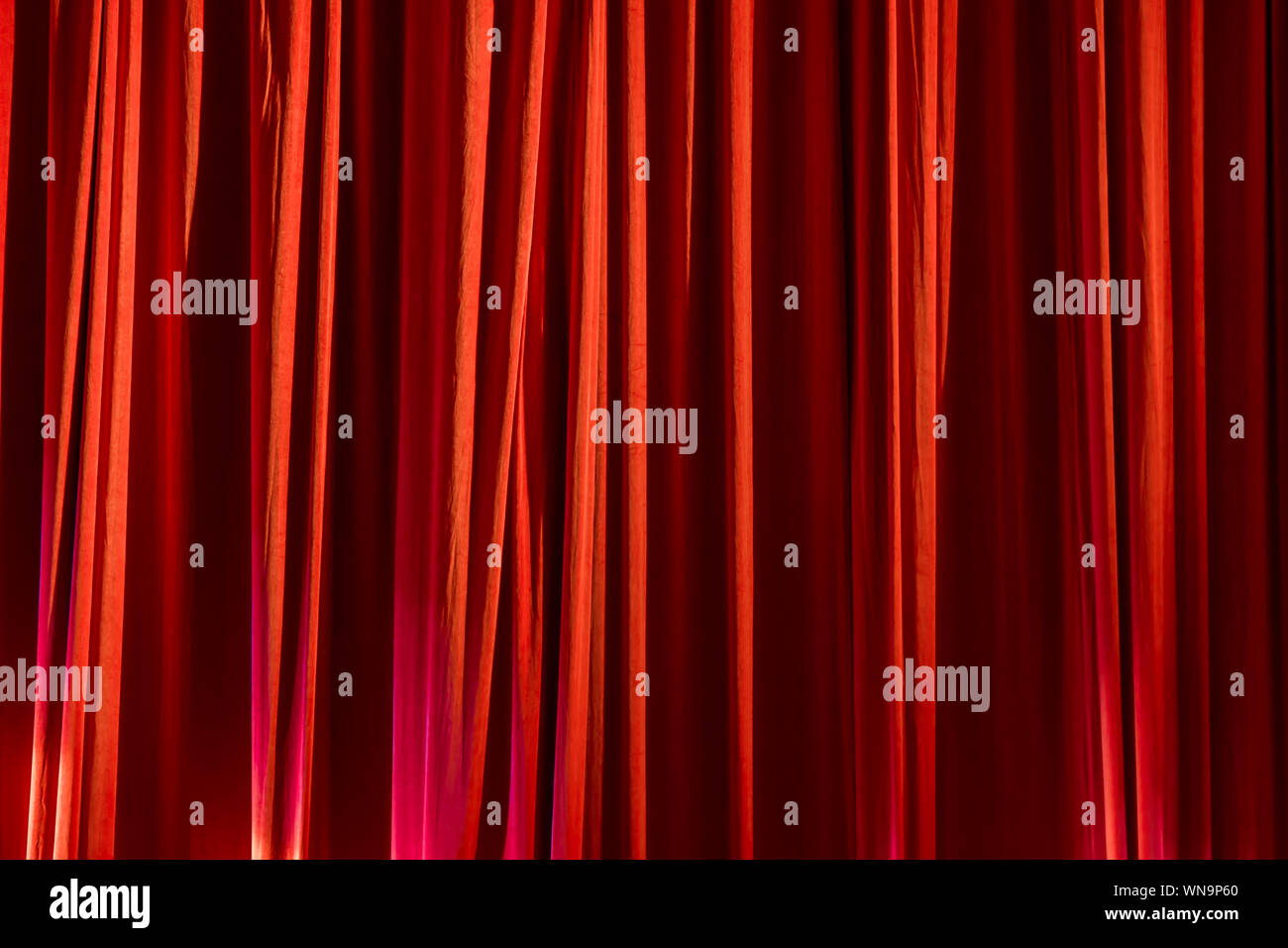 Red curtains and the spotlight in the Theater between shows Stock Photo ...